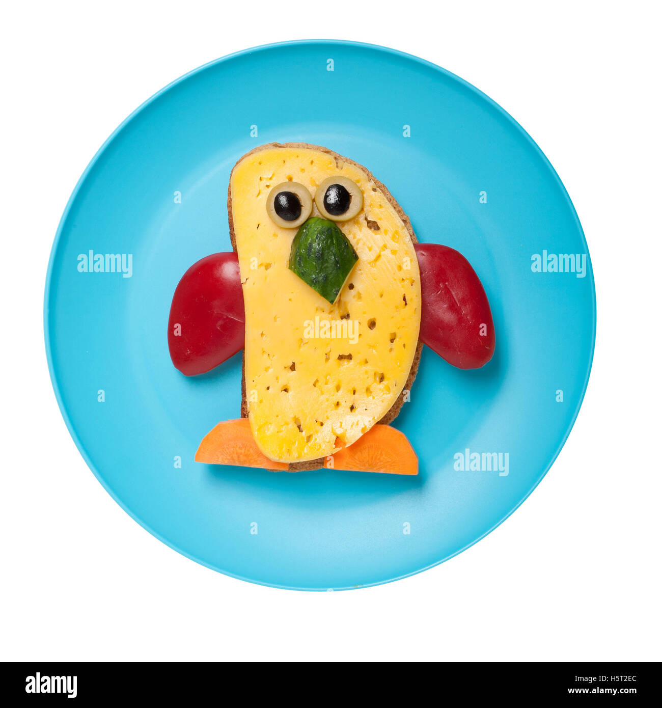 Penguin made of bread and cheese on plate Stock Photo - Alamy