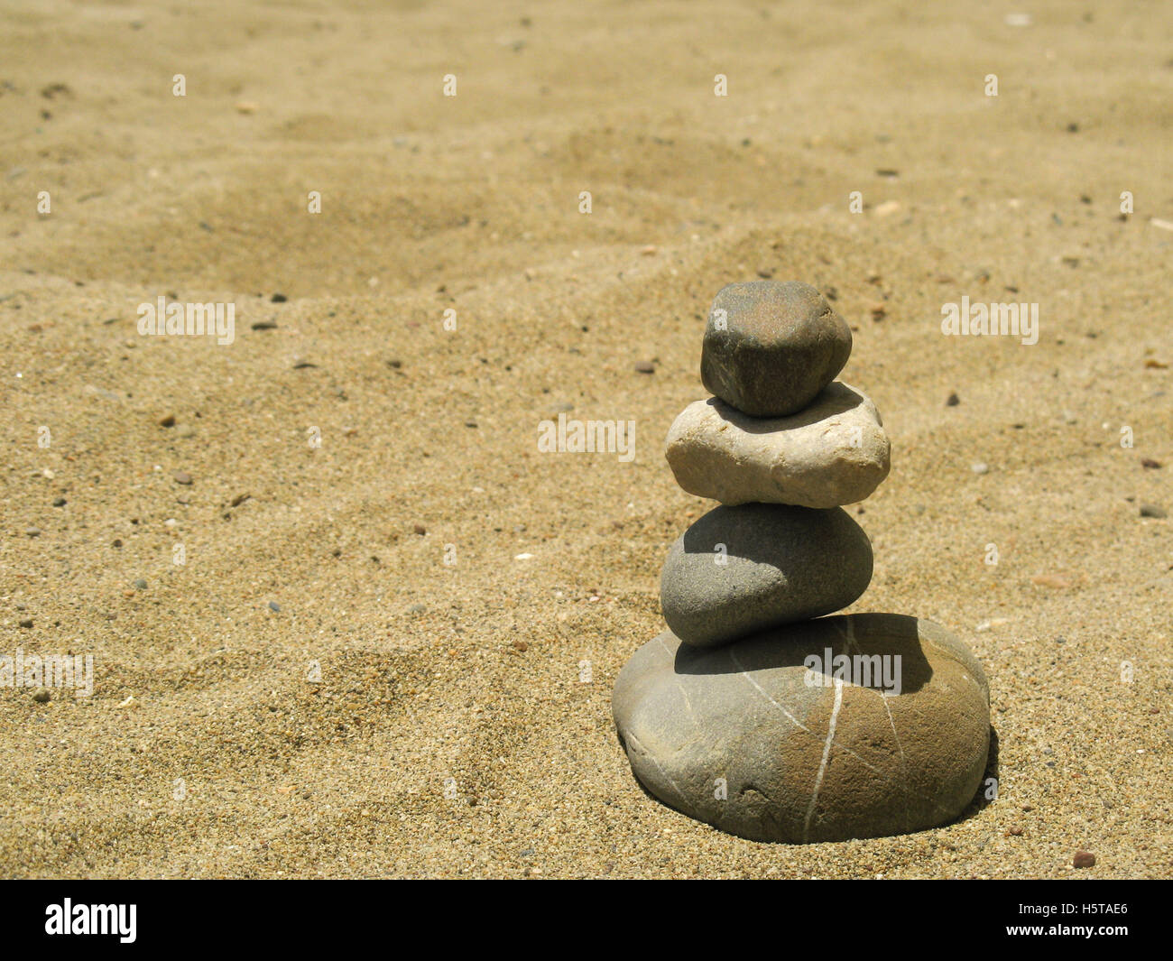 Tranquility stones on the beach Stock Photo - Alamy