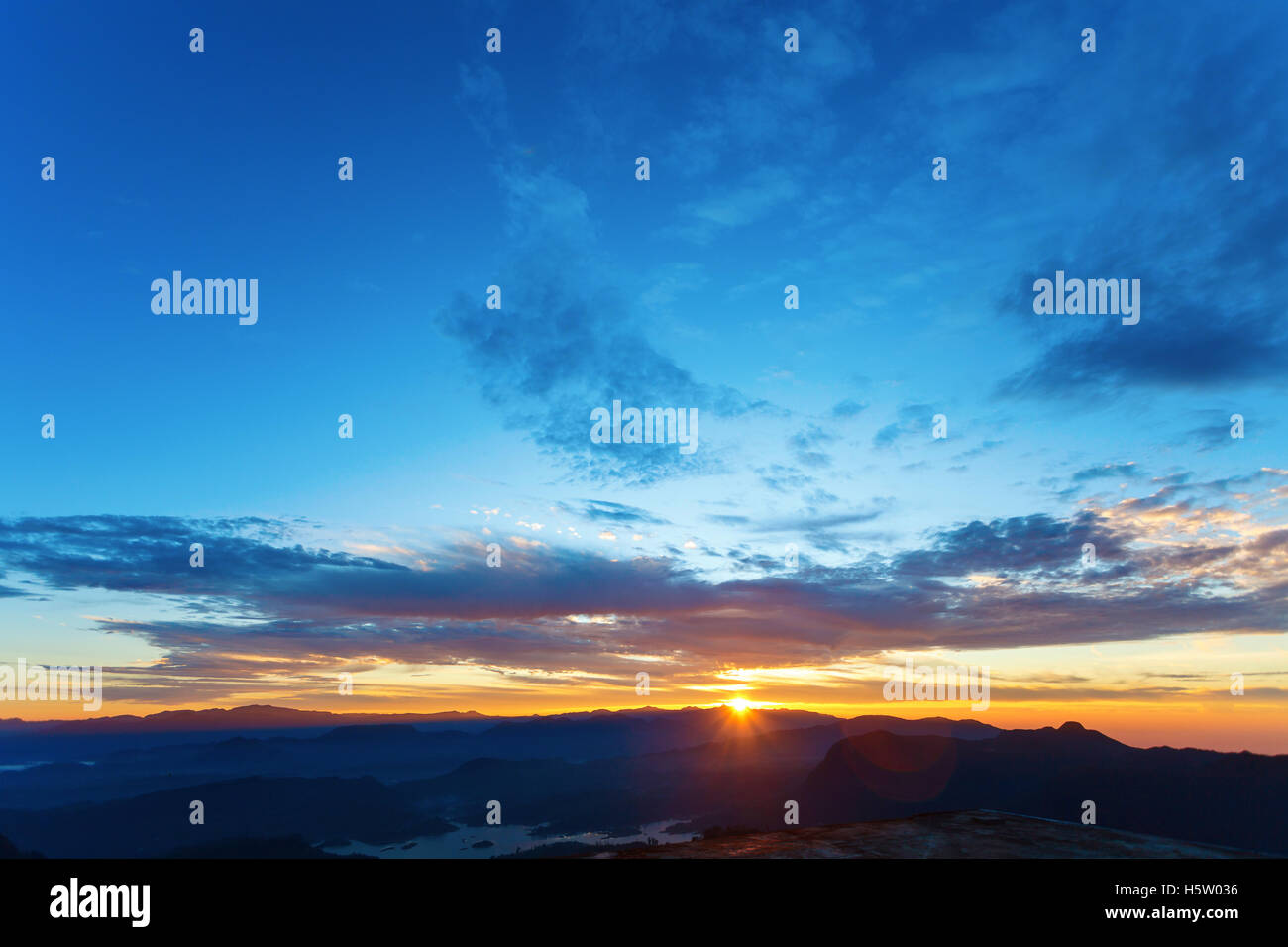 Sunrise at mountains Stock Photo - Alamy