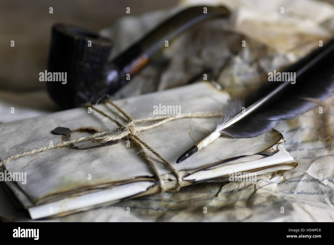 old paper letter feather Stock Photo - Alamy