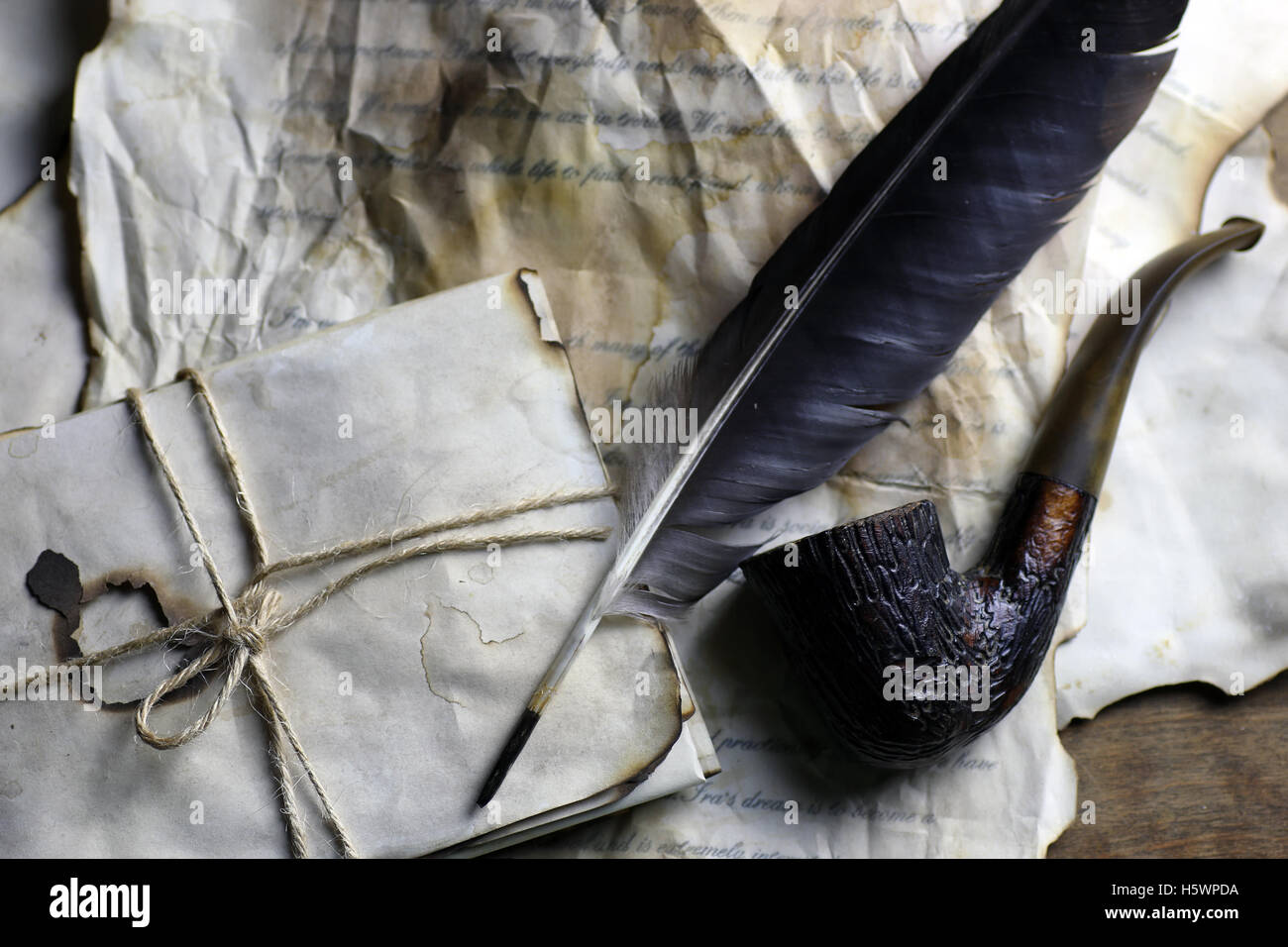 old paper letter feather Stock Photo - Alamy