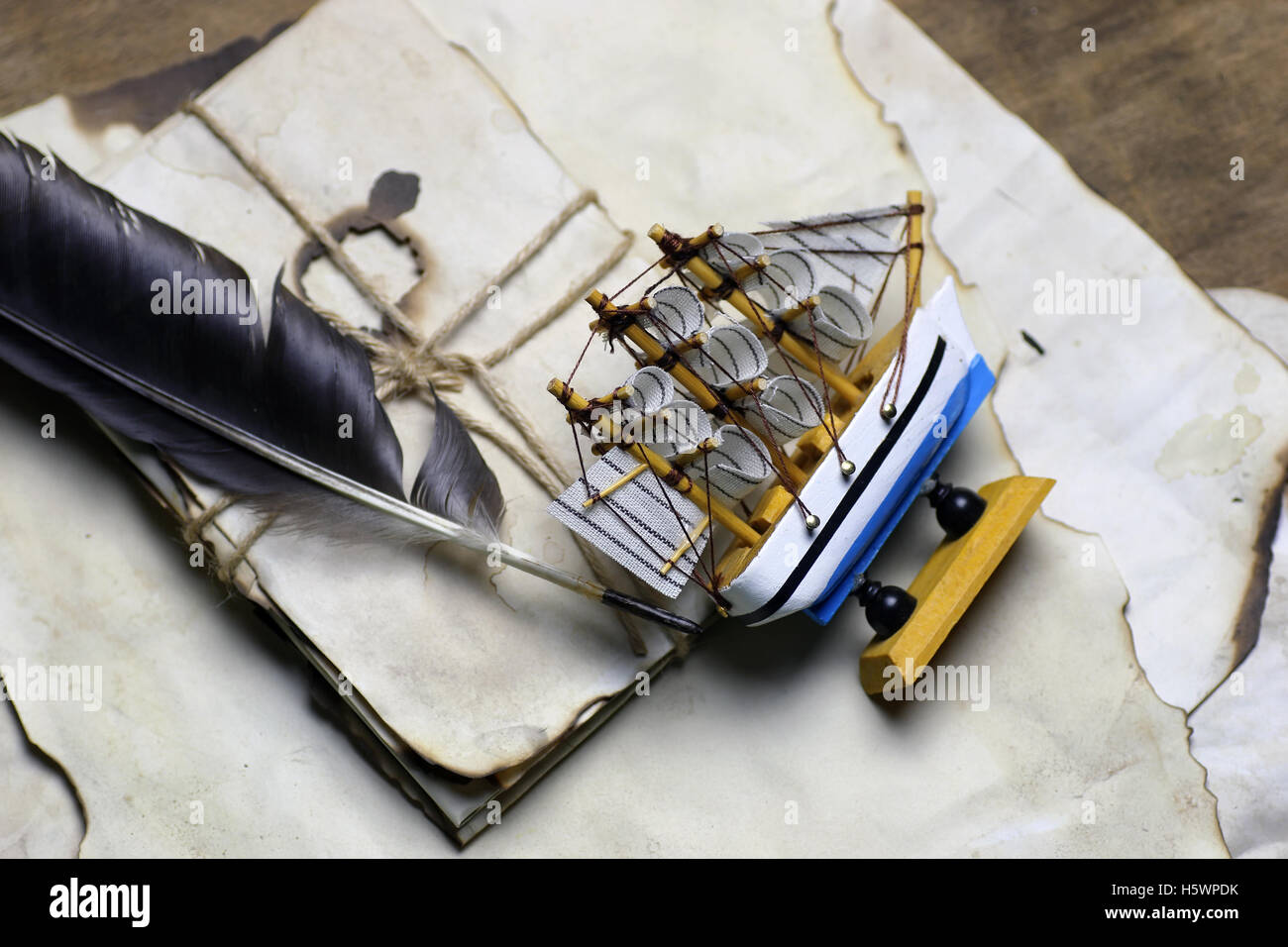 old paper letter feather Stock Photo - Alamy