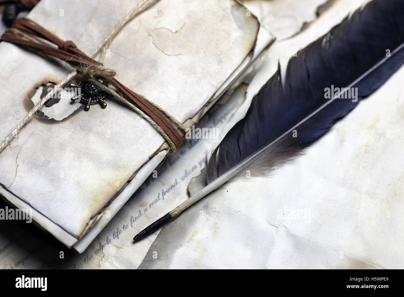 old paper letter feather Stock Photo - Alamy