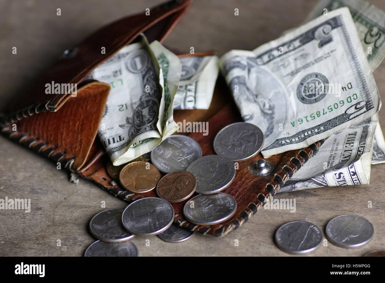change and crumpled banknote Stock Photo - Alamy