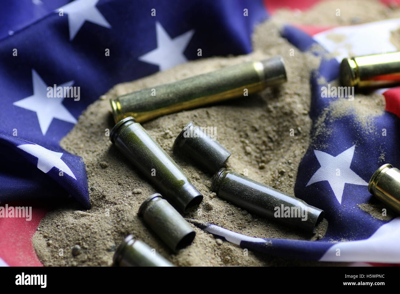 bullet and usa flag in the sand war Stock Photo - Alamy