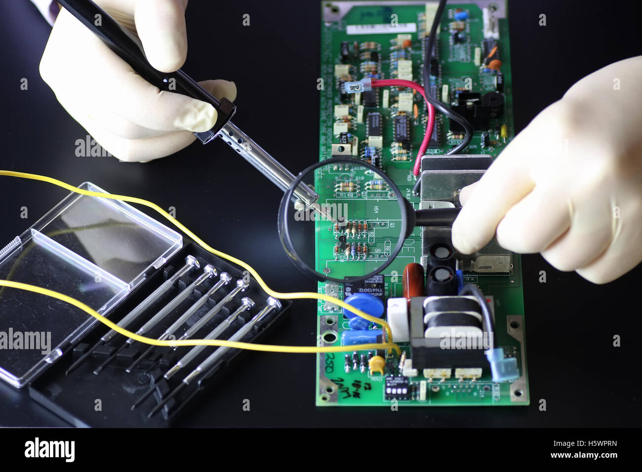 man hands chip soldering tools Stock Photo - Alamy