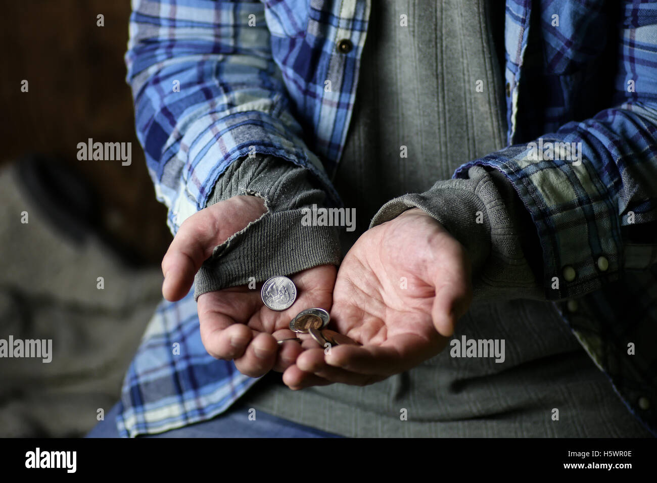 homeless man hand help Stock Photo - Alamy