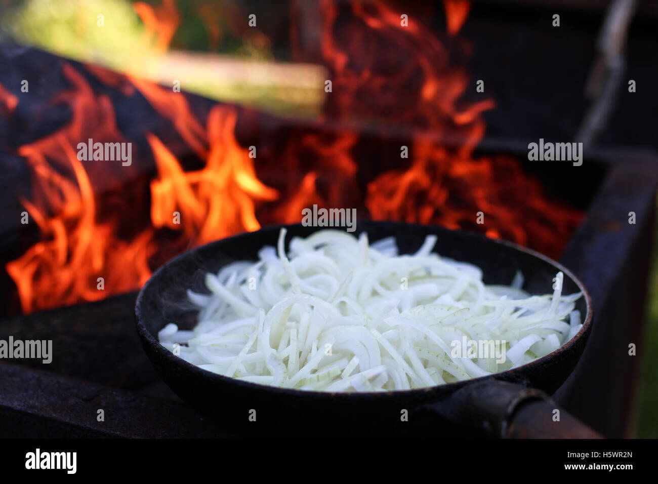 onion fry on fire outdoors Stock Photo - Alamy