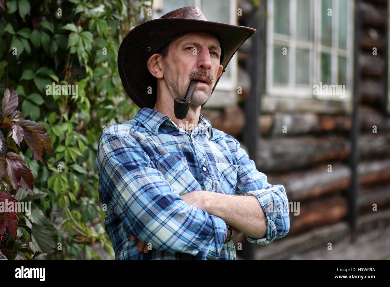 cowboy man smoke pipe Stock Photo - Alamy