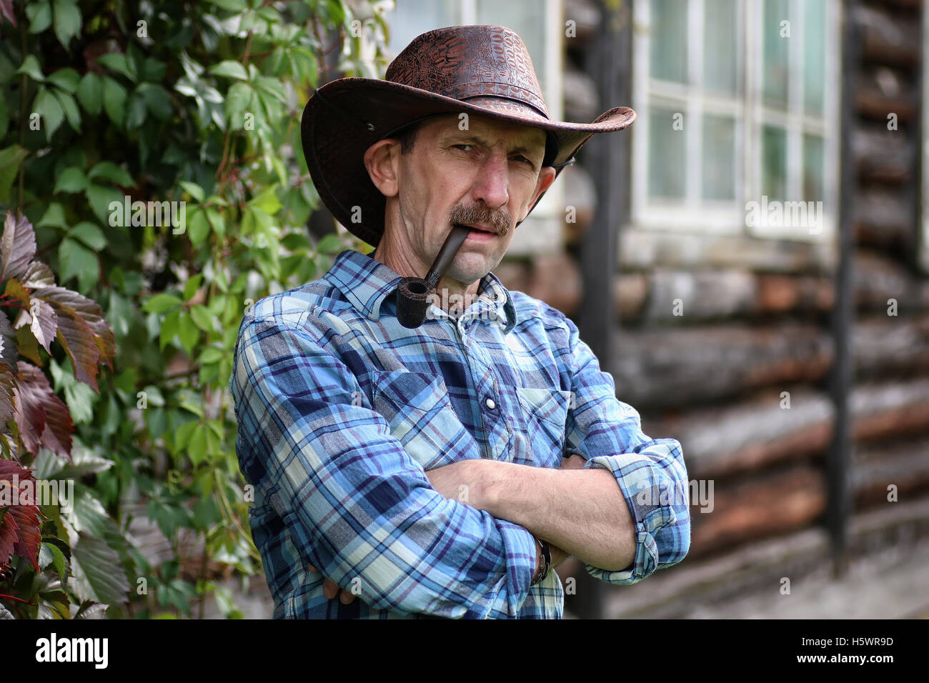 cowboy man smoke pipe Stock Photo - Alamy