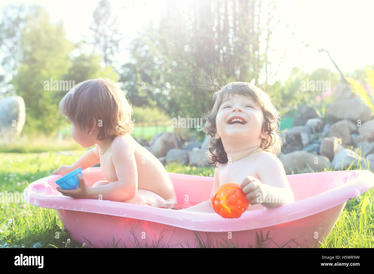 kids in bath water outdoor Stock Photo - Alamy