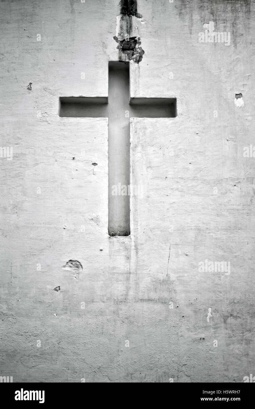 Cross figure religion wall Stock Photo - Alamy