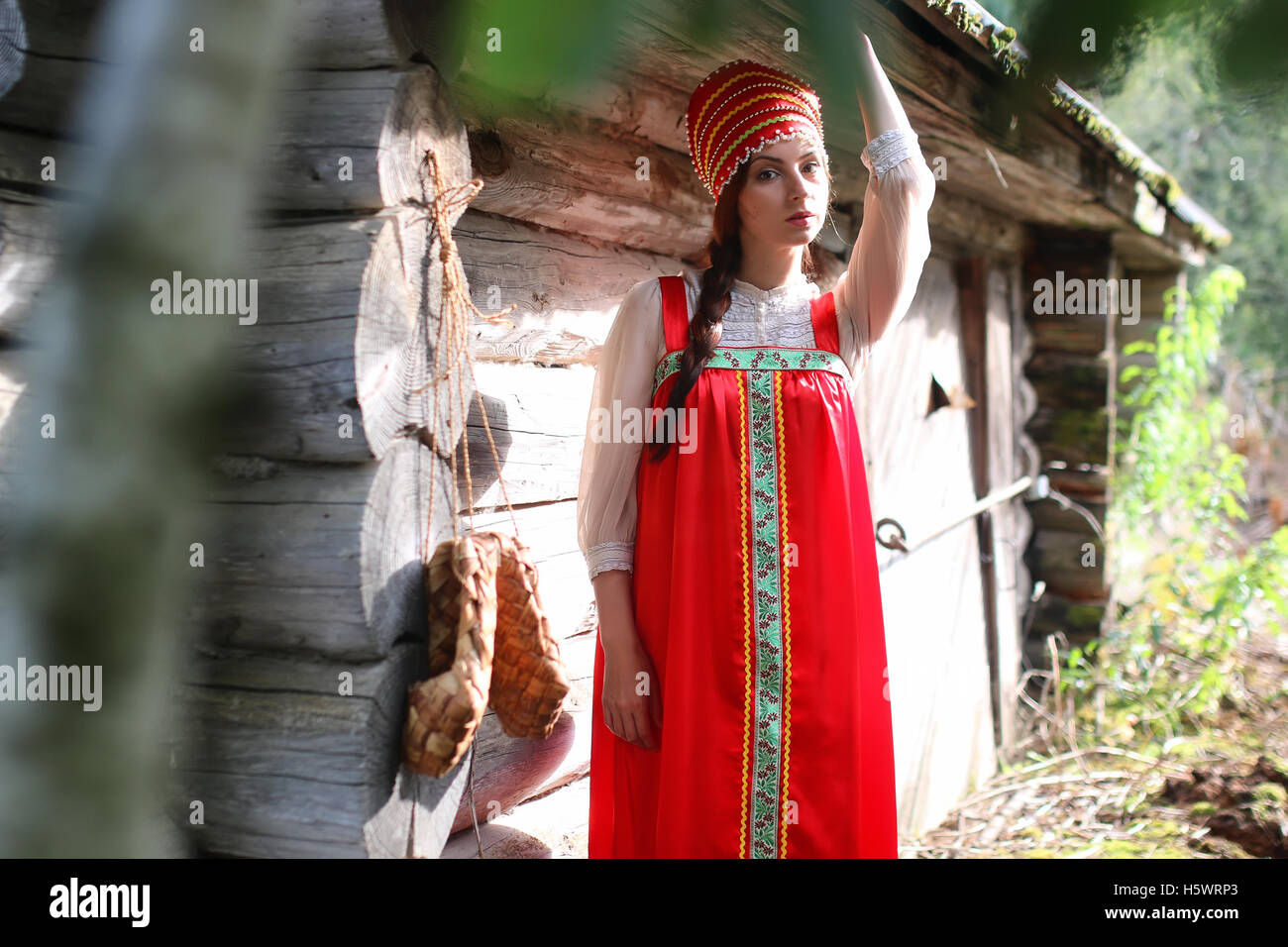 girl traditional dress log Stock Photo - Alamy