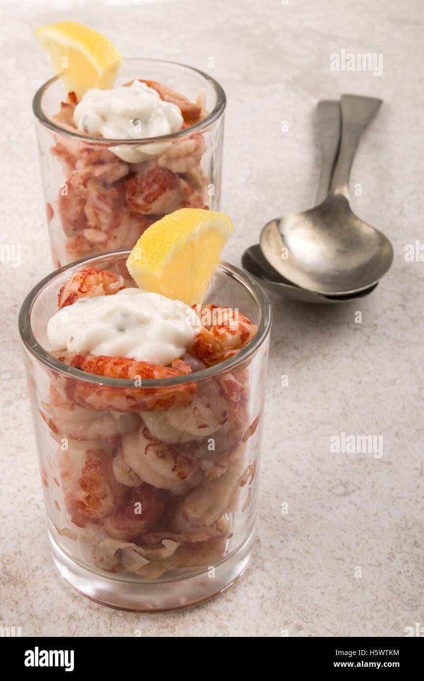 cooked crayfish tails cocktail with garlic mayonnaise and lemon in a ...