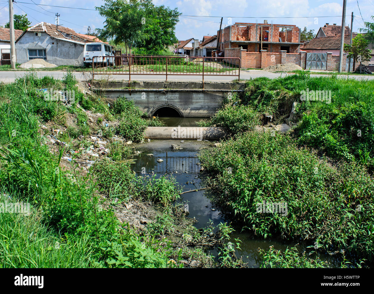 Very polluted river that runs through the village Stock Photo - Alamy