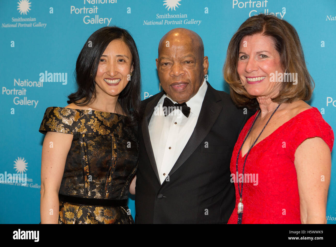 (L-R) Clara Shin, Congressman John Lewis and guest on the red carpet at ...