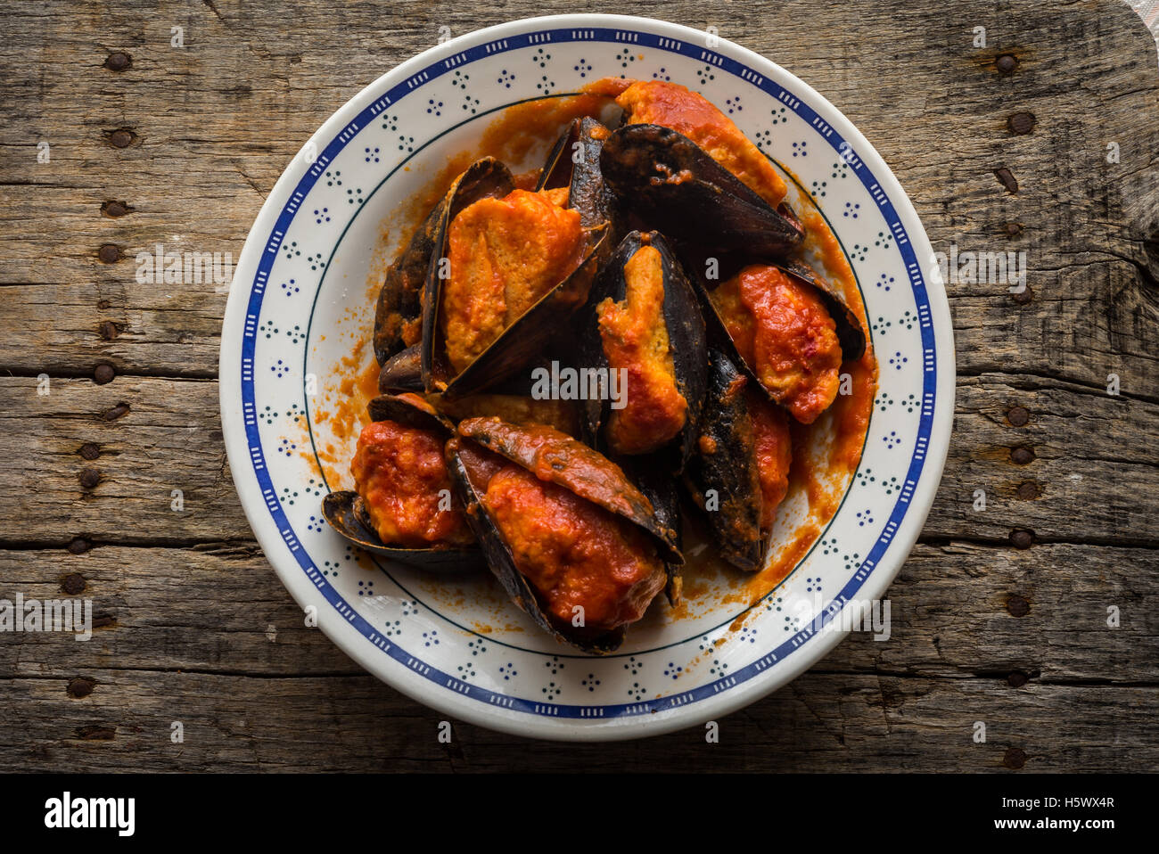 Traditional stuffed mussels with tomato sauce, typical from Puglia ...