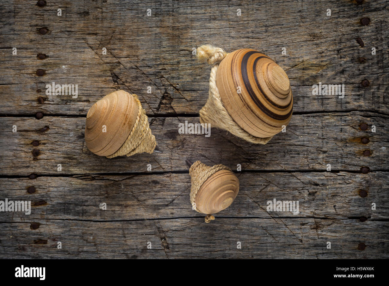 Old vintage spinning tops with small rope Stock Photo - Alamy