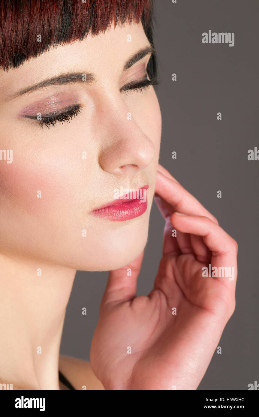 Beautiful young woman feeling soft skin Stock Photo - Alamy