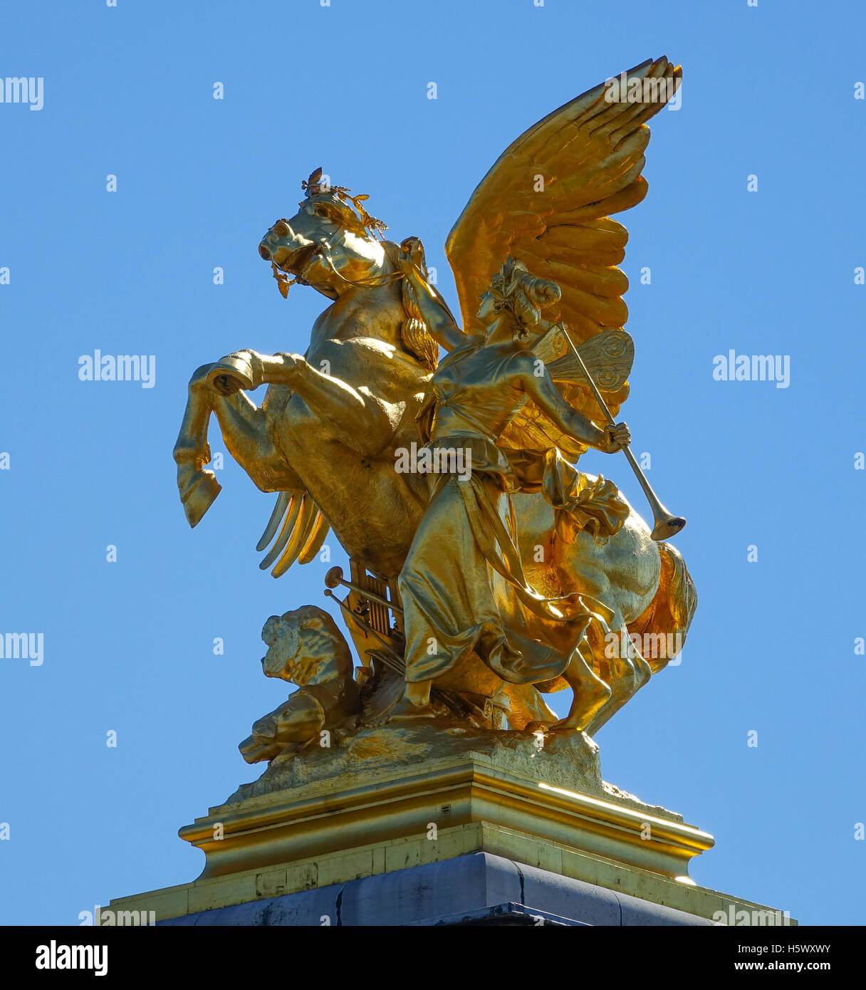 The golden statues on Alexandre III bridge in Paris Stock Photo - Alamy