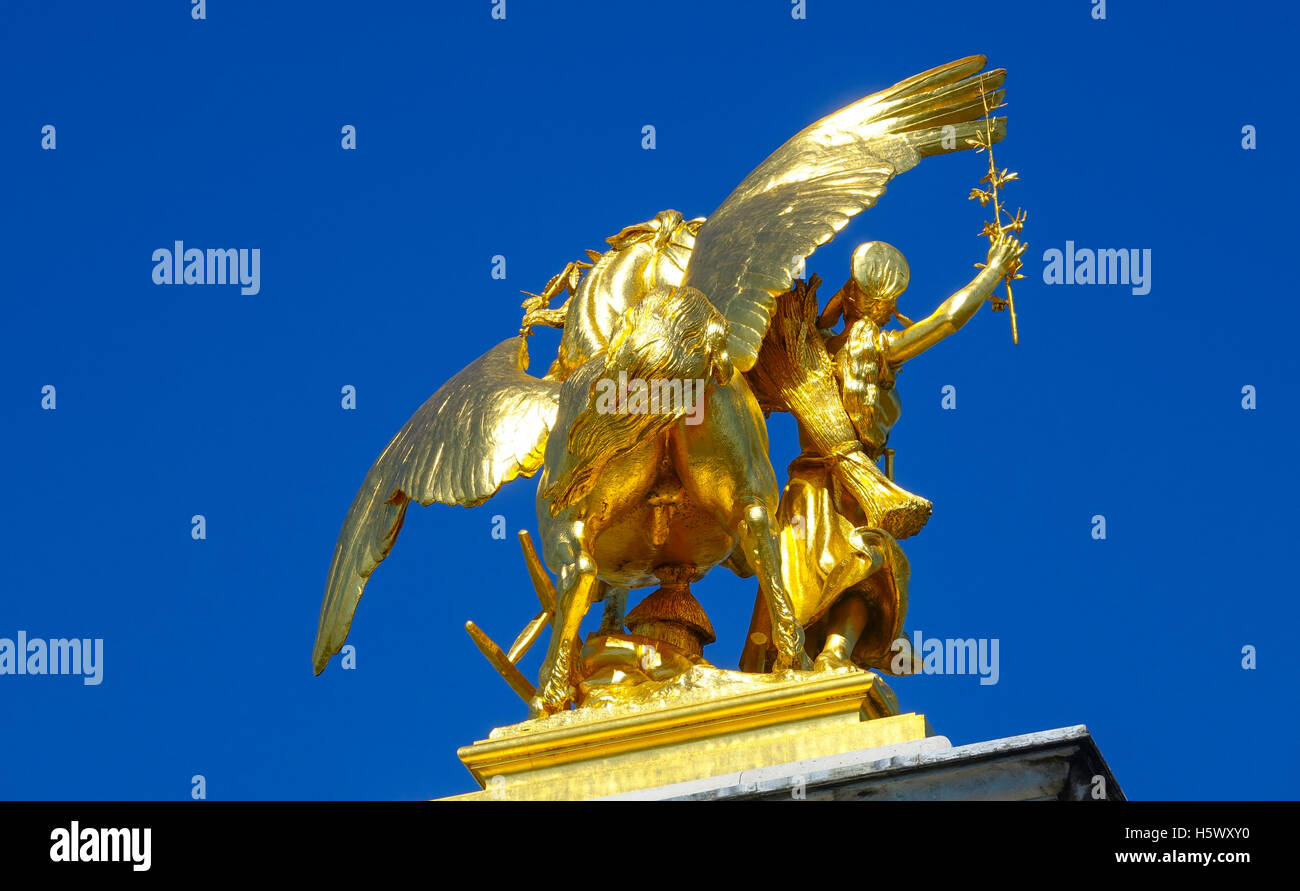 The golden sculptures on Alexandre III bridge in Paris Stock Photo - Alamy