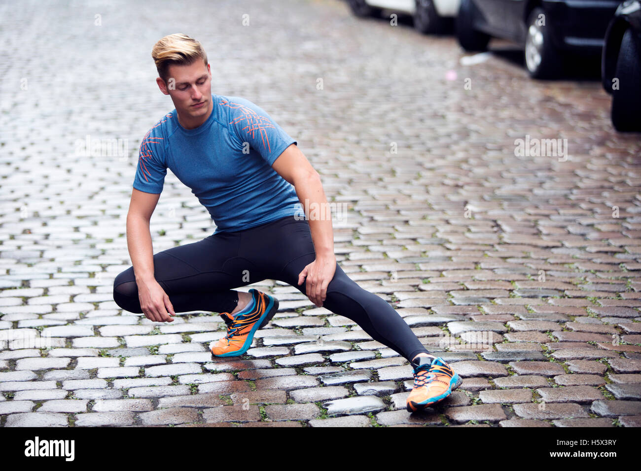 Man muscles stretching not woman hi-res stock photography and images ...