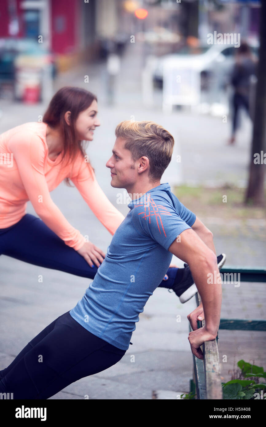 young couple doing workout outdoors in the street Stock Photo - Alamy