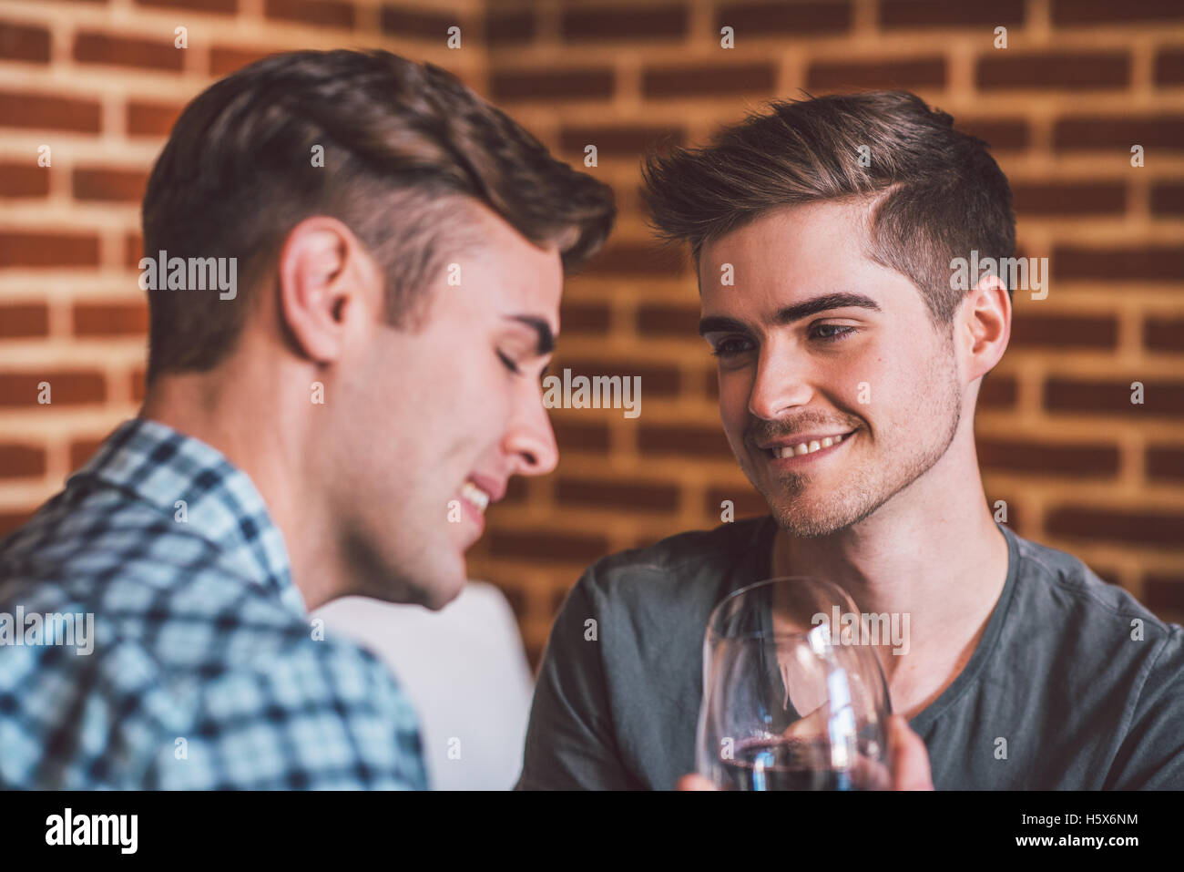 Catching up over some fine wine Stock Photo - Alamy