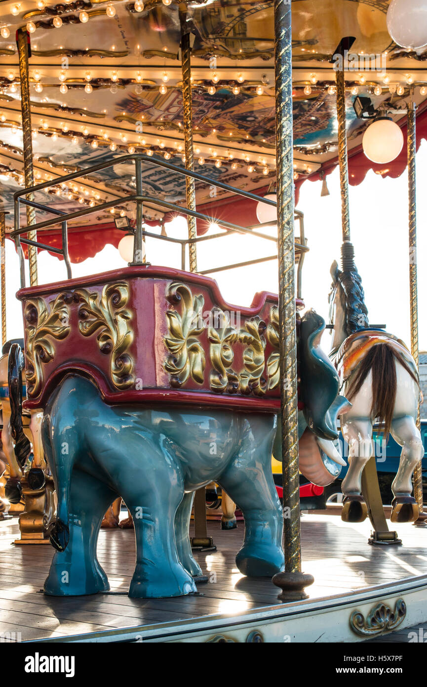 Carousel with horses in amusement park Stock Photo - Alamy