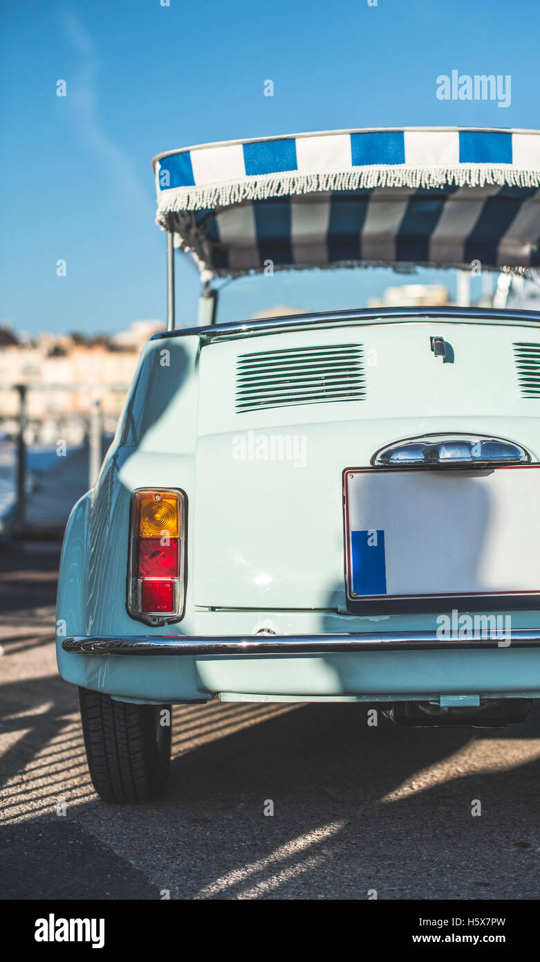Vintage small blue car on sunlight Stock Photo - Alamy