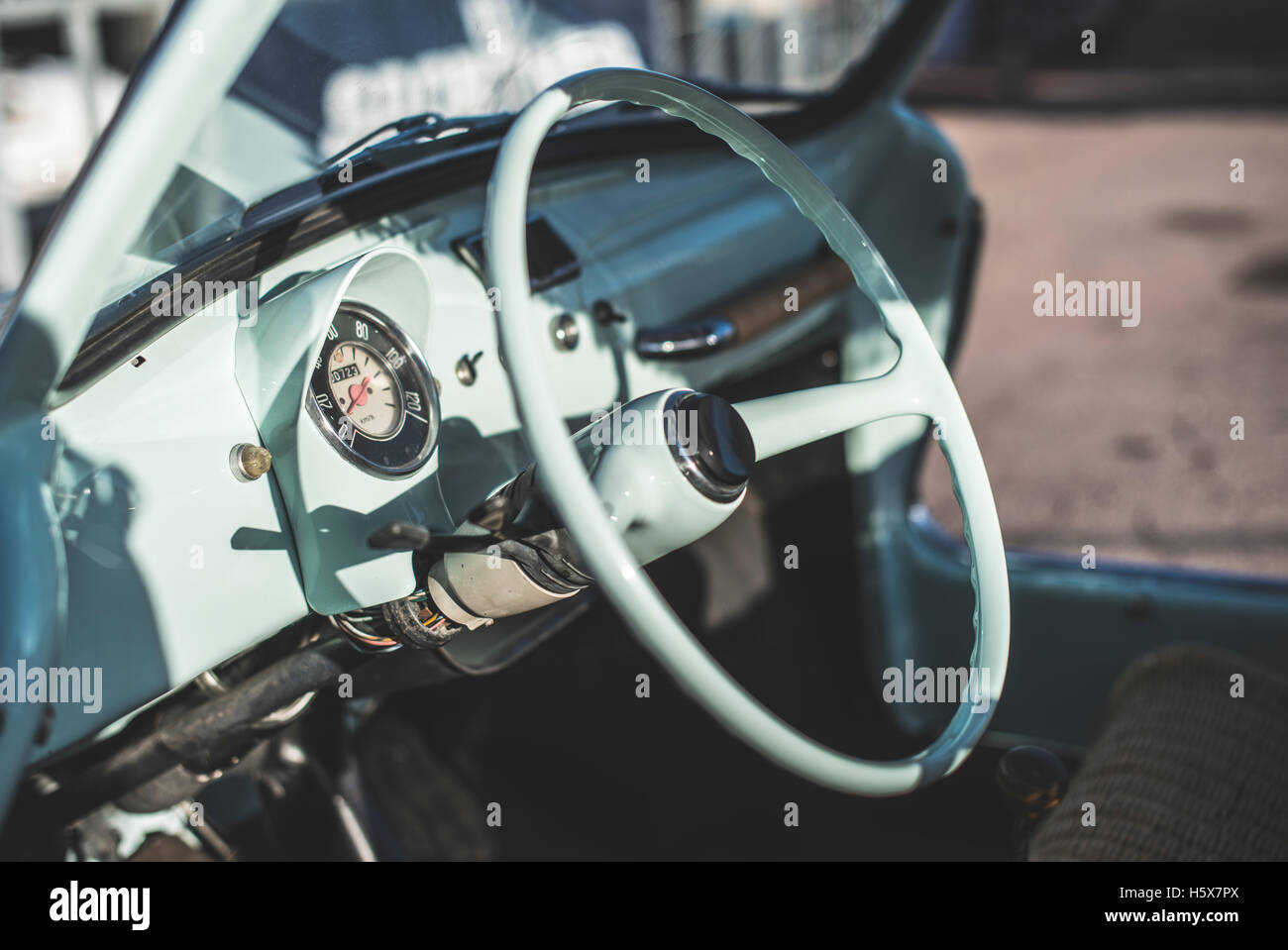 Vintage small blue car on sunlight Stock Photo - Alamy