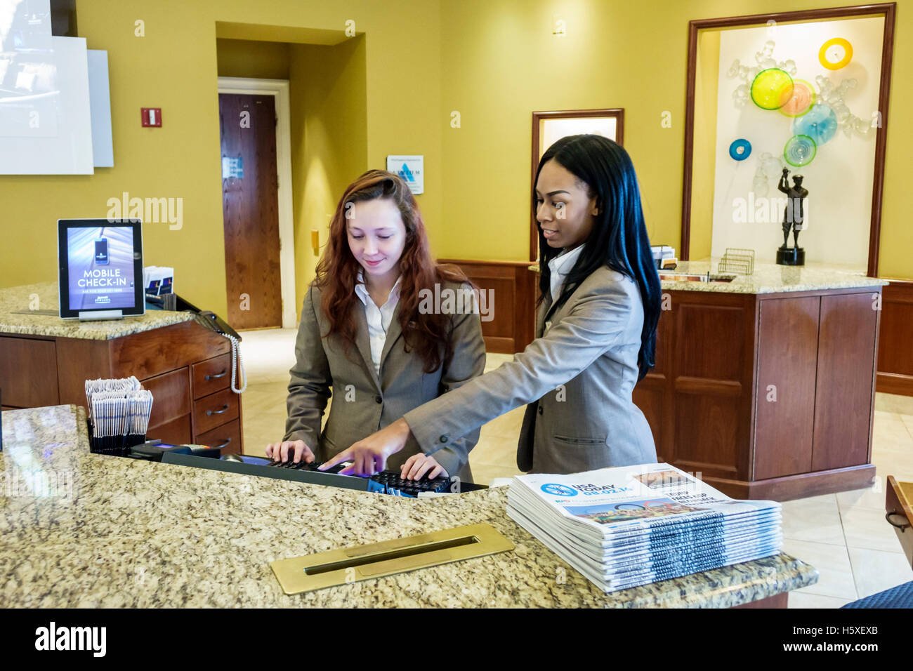 Inside interior lobby front check in reception desk hi-res stock ...