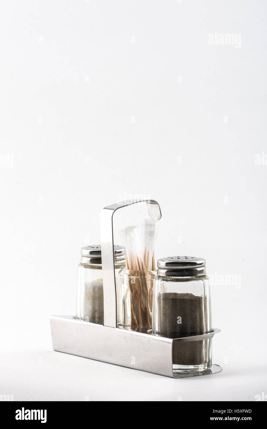 Transparent glass shakers with salt and pepper Stock Photo - Alamy