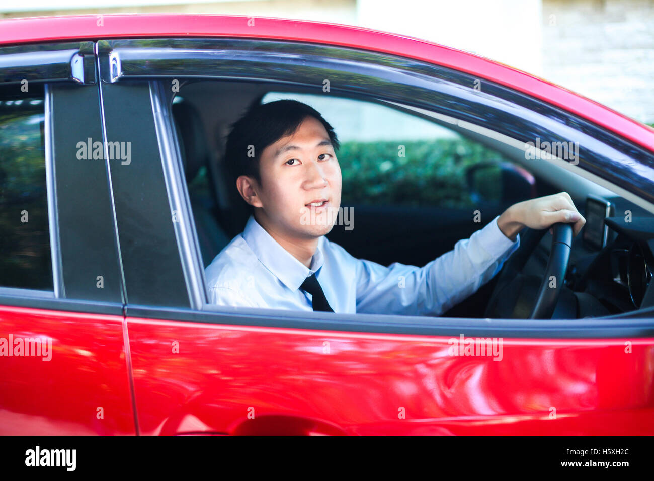 Portrait of Asian Business Man Driving His Red Car Stock Photo - Alamy