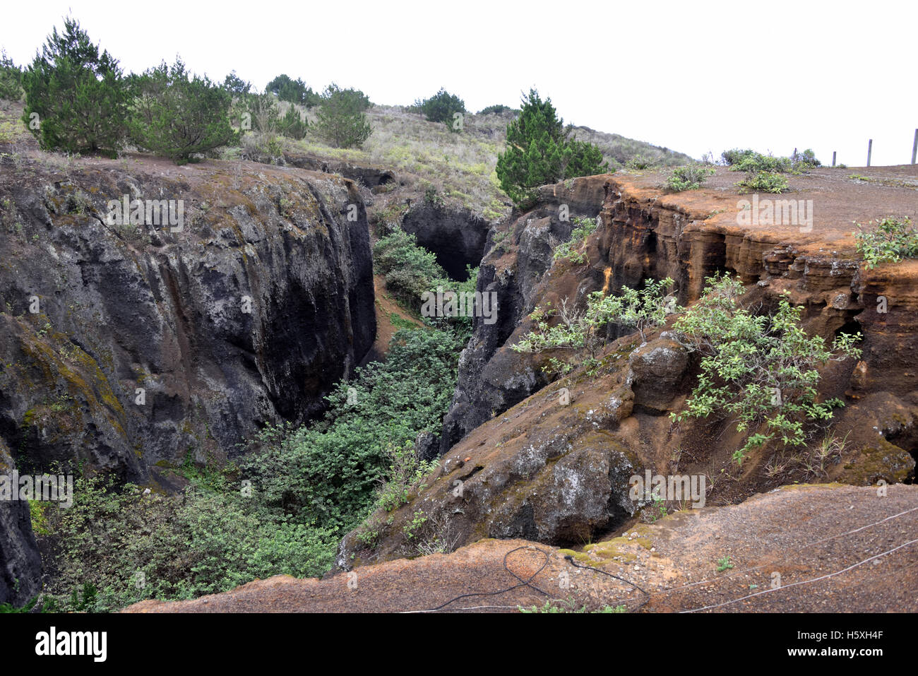 The Devil's Ashpit - a large fissure in pyroclastic deposits Stock ...