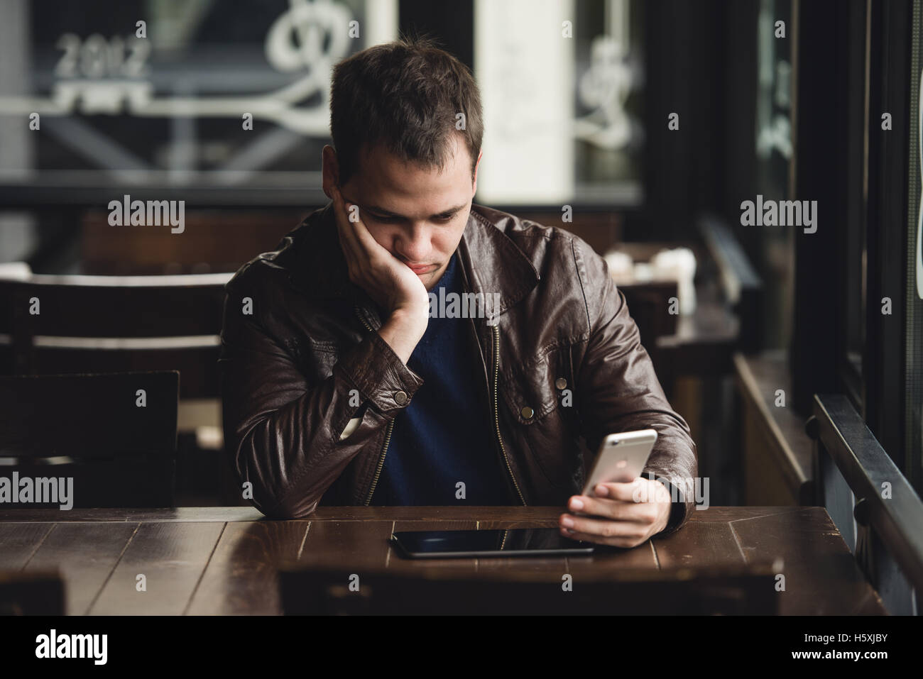 Closeup portrait, stressed young man in purple sweater, shocked ...