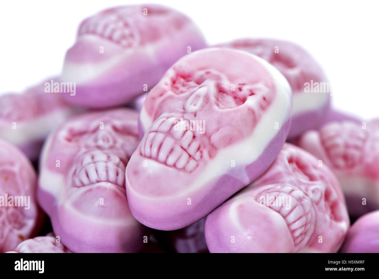 closeup of a pile of skull-shaped candies on a white background Stock ...