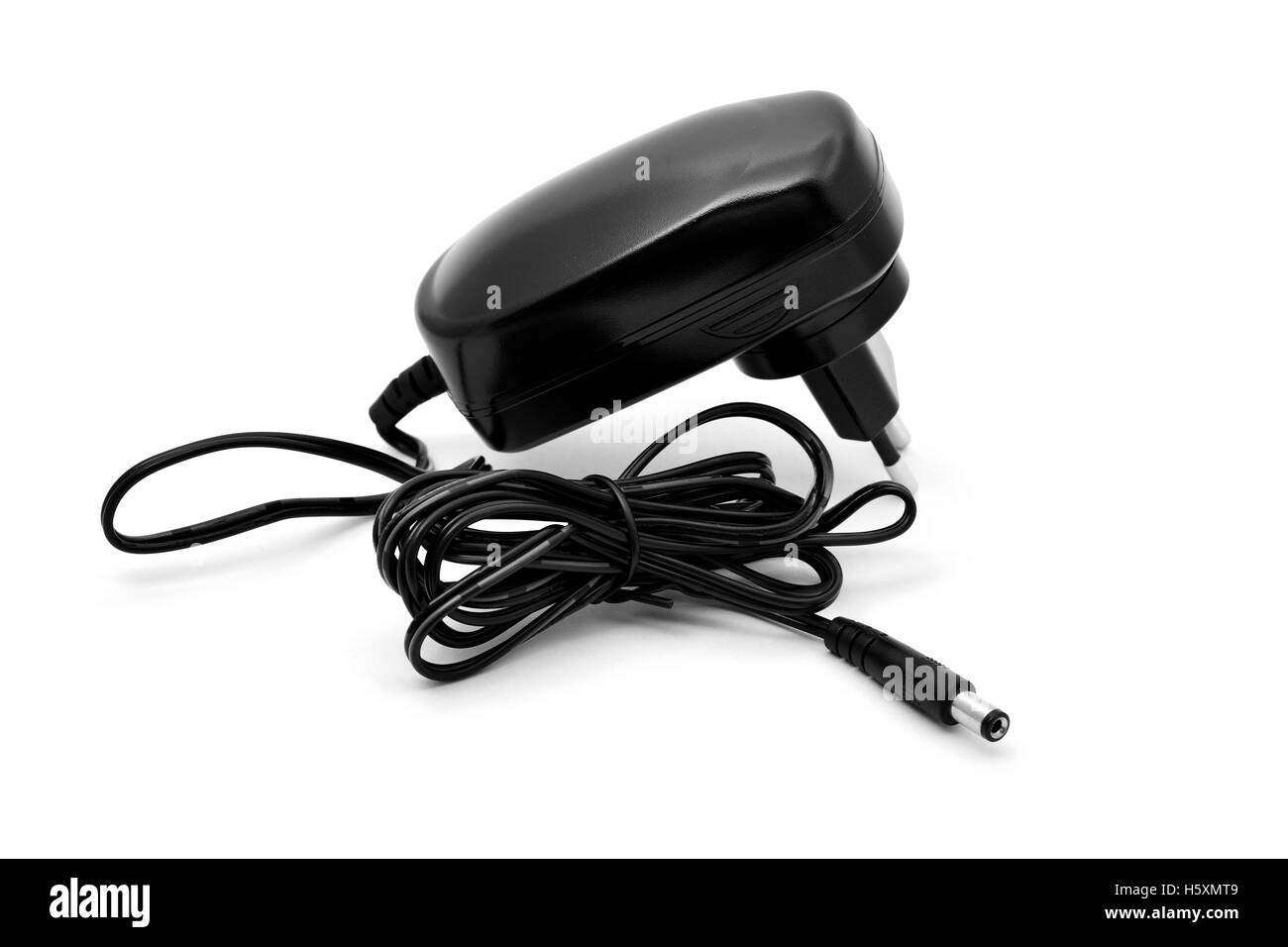an AC adapter on a white background Stock Photo - Alamy