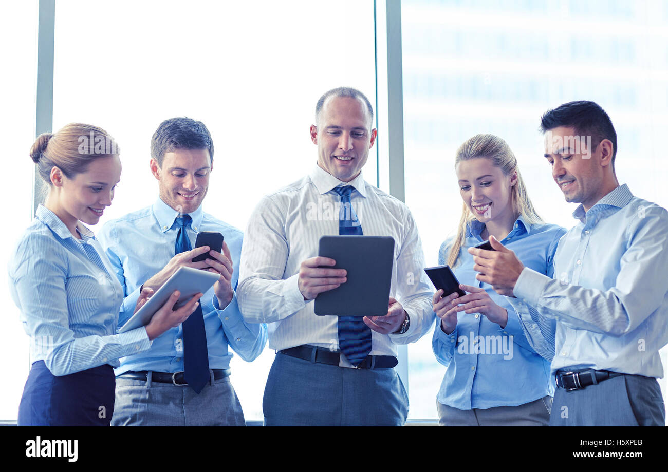 business people with tablet pc and smartphones Stock Photo - Alamy