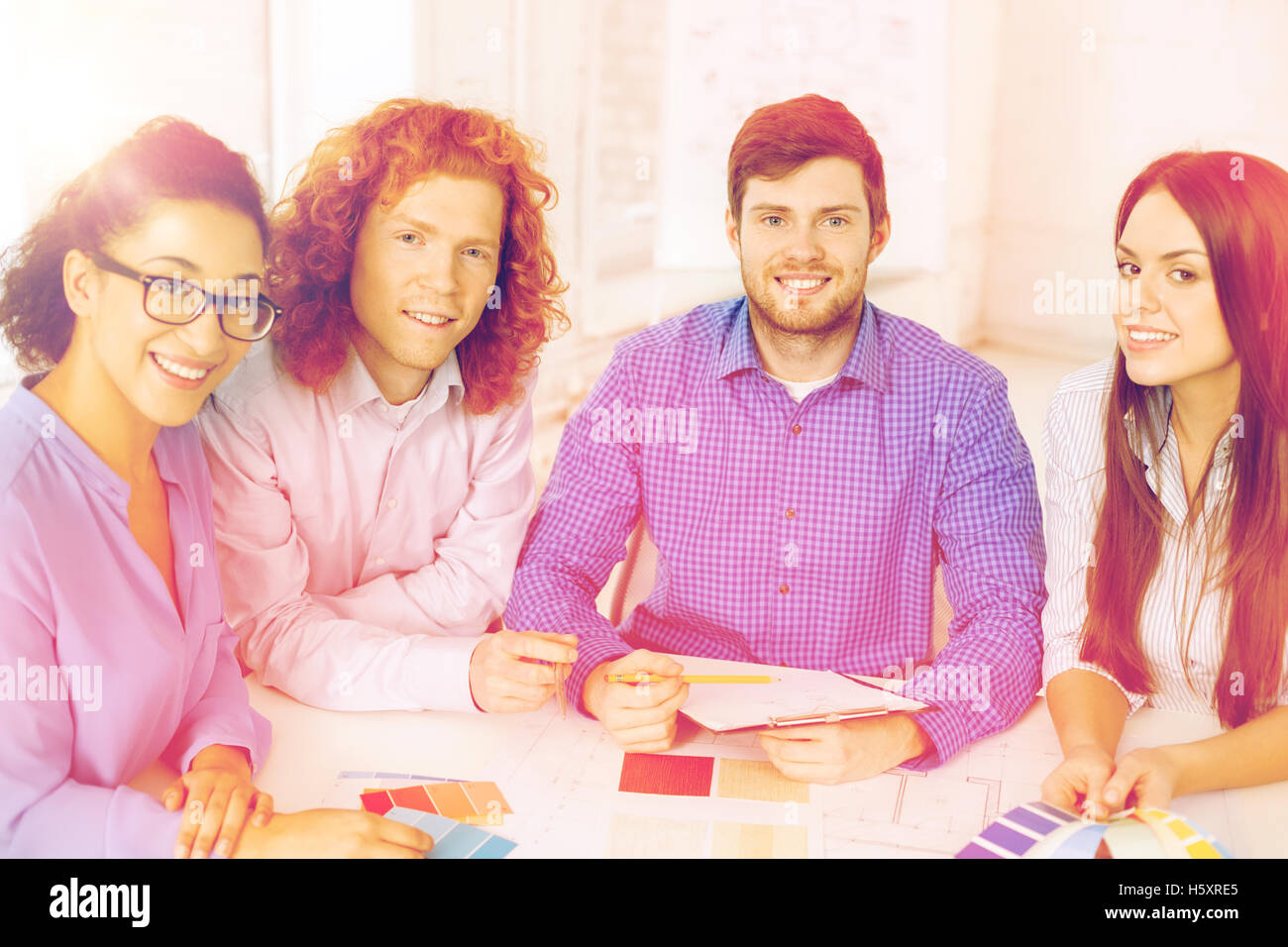 team with color samples and blueprint at office Stock Photo - Alamy