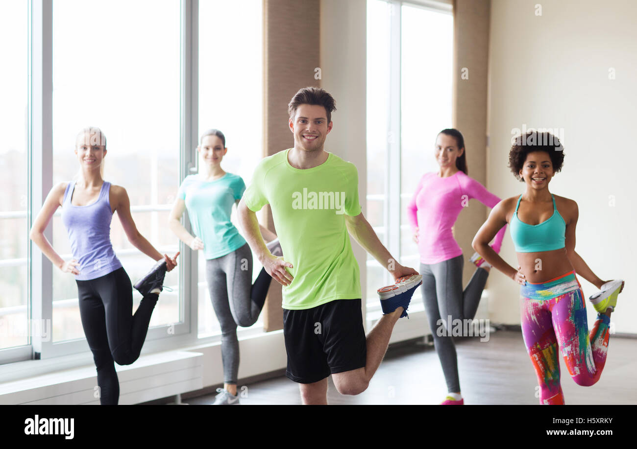 group of smiling people exercising in gym Stock Photo - Alamy