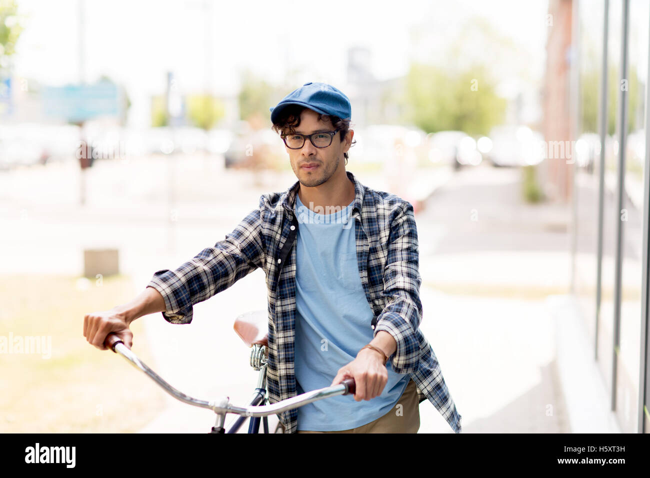 Man walking bicycle hi-res stock photography and images - Alamy