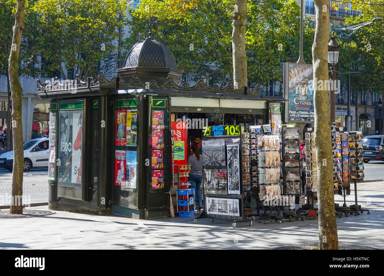 Newspaper and souvenir sale in the streets of Paris Stock Photo - Alamy