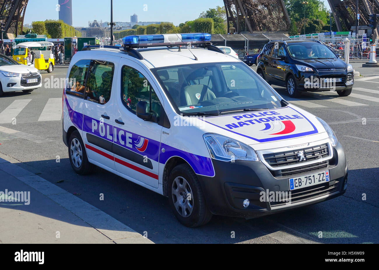 Police car in Paris at Eiffel Tower Stock Photo - Alamy