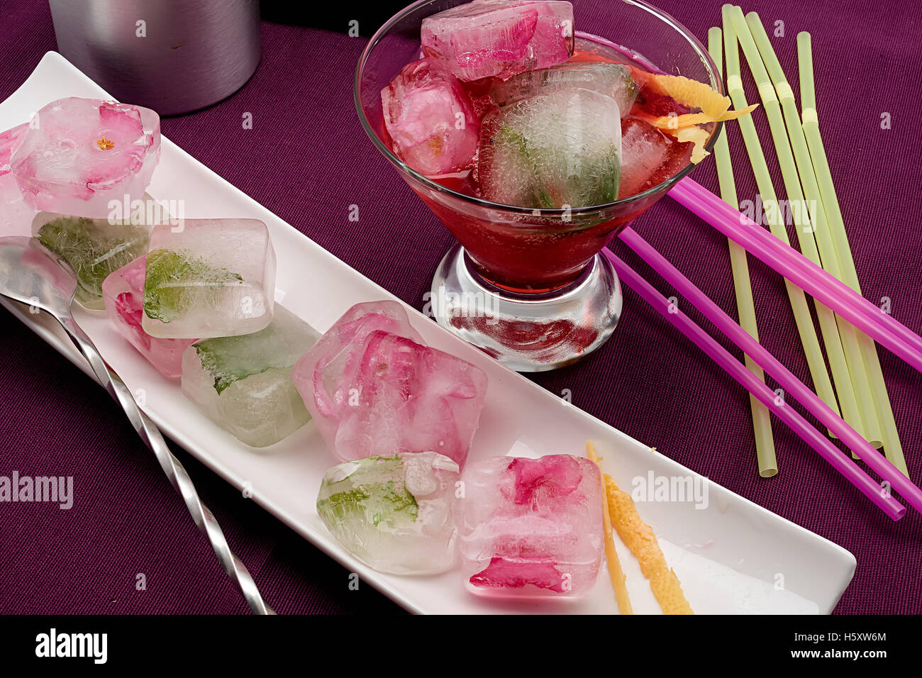 cocktail with Flower Ice Cubes composition Stock Photo - Alamy