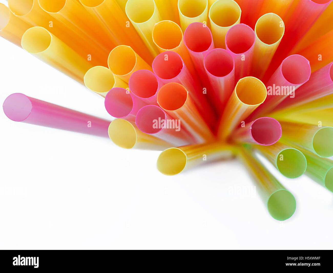 Colored Plastic Drinking Straws on a white background Stock Photo - Alamy