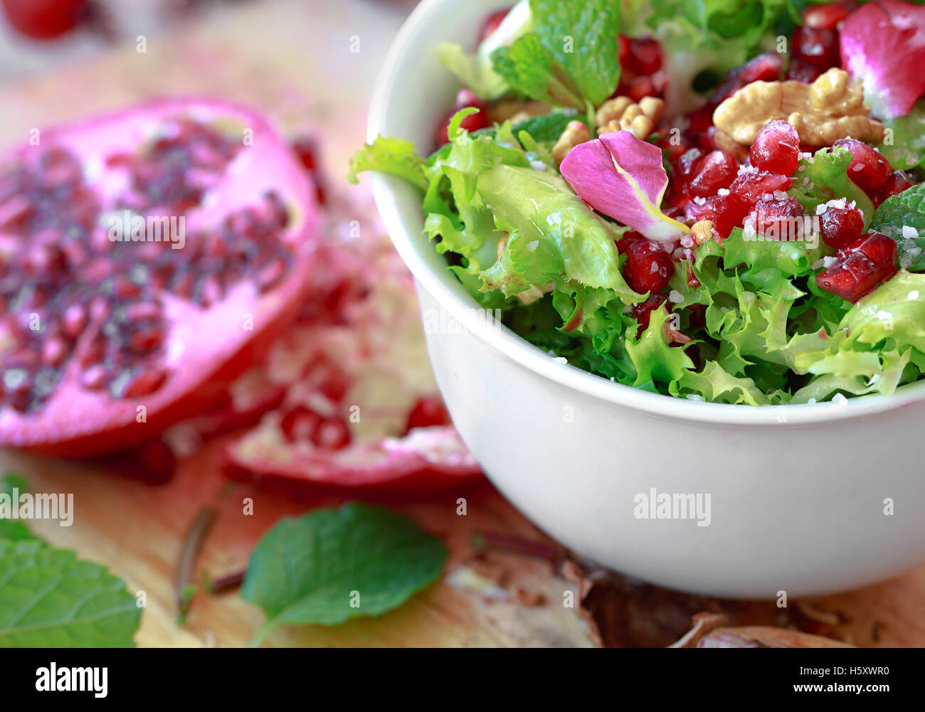 Curly endive salad with pomegranate, nuts, rose petals, peppermint ...