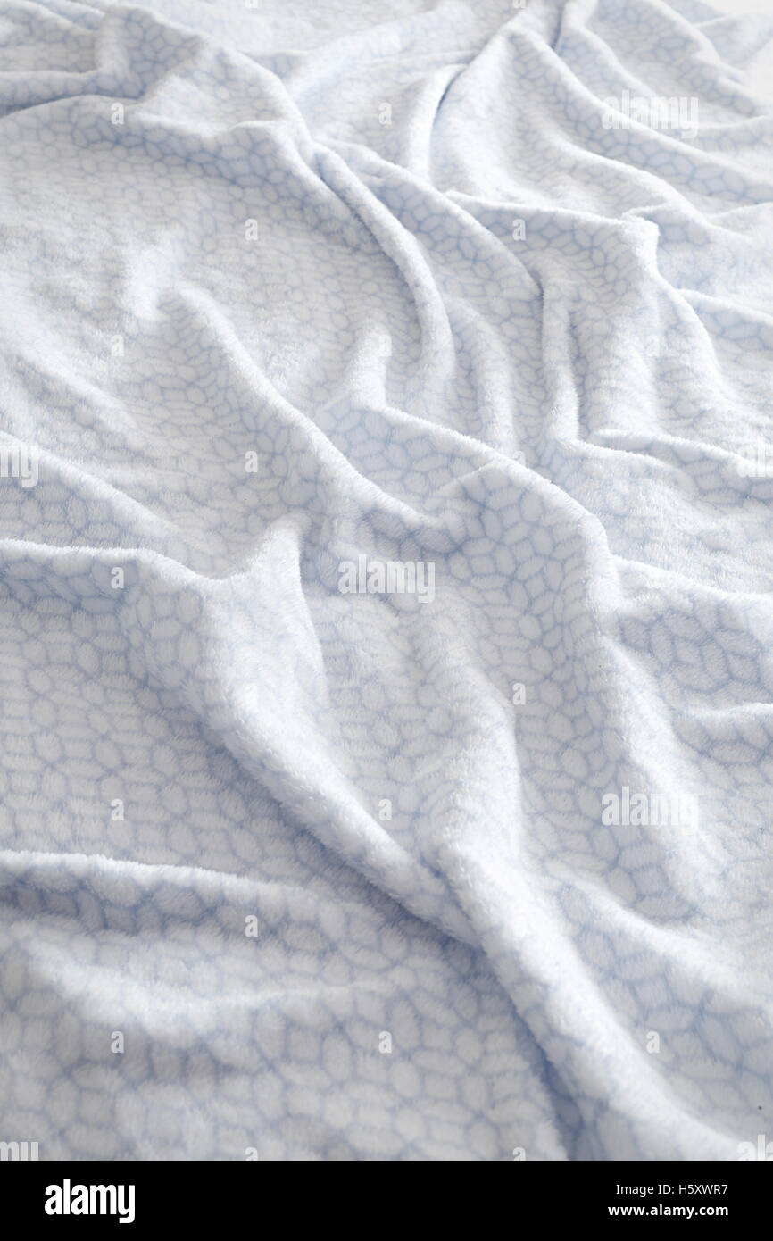 Soft white and blue bed sheet background Stock Photo - Alamy