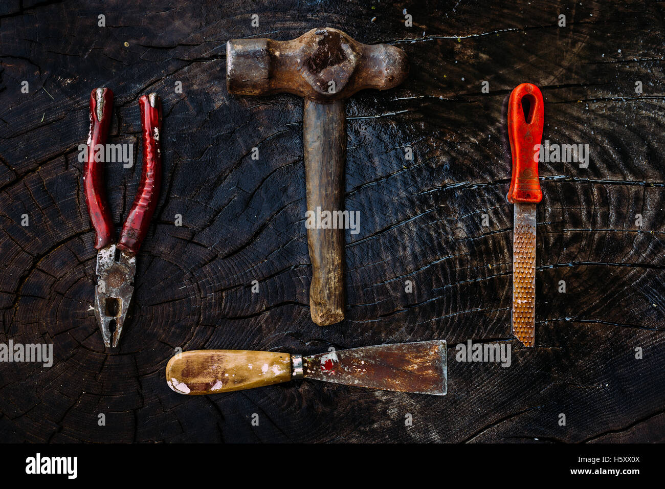 Set of manual tools on a dark wooden background Stock Photo - Alamy