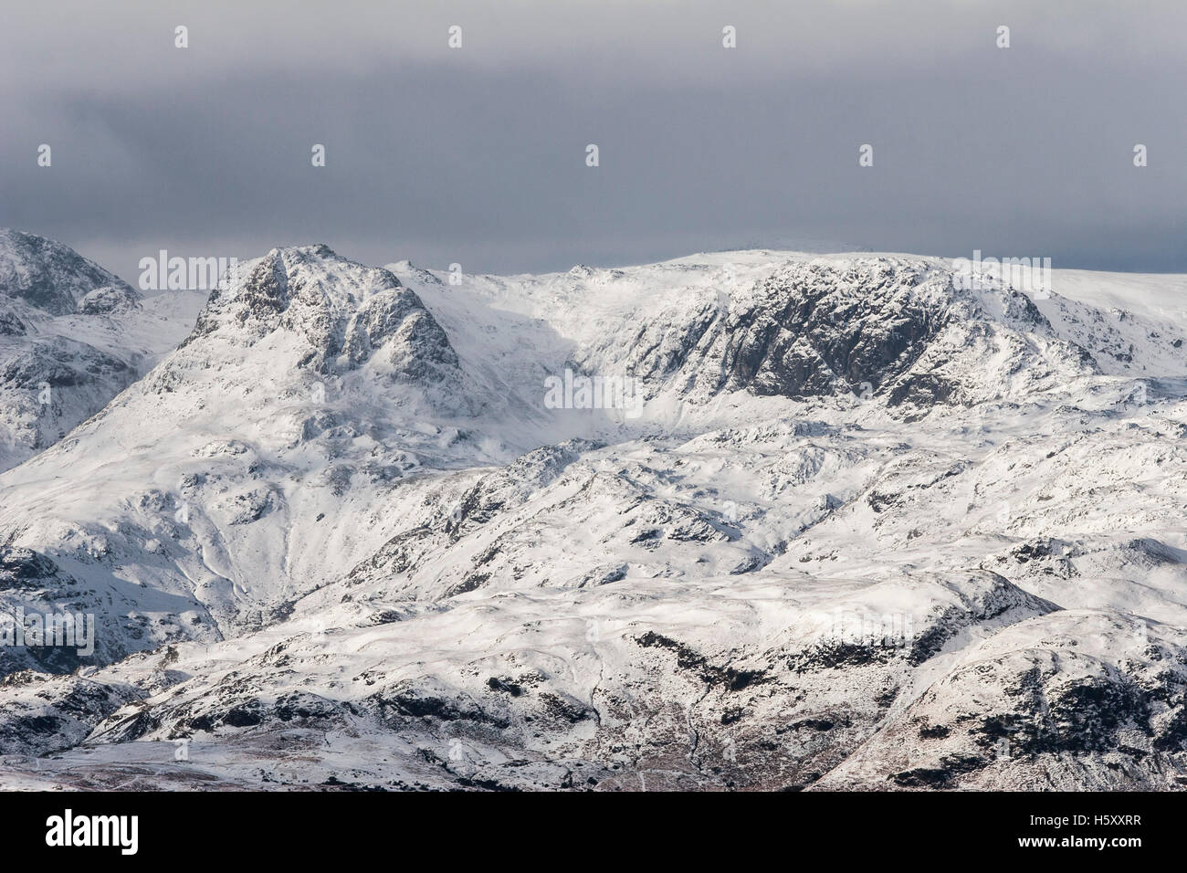 The Langdale Pikes covered in snow. Harrison Stickle and Pavey Ark in ...